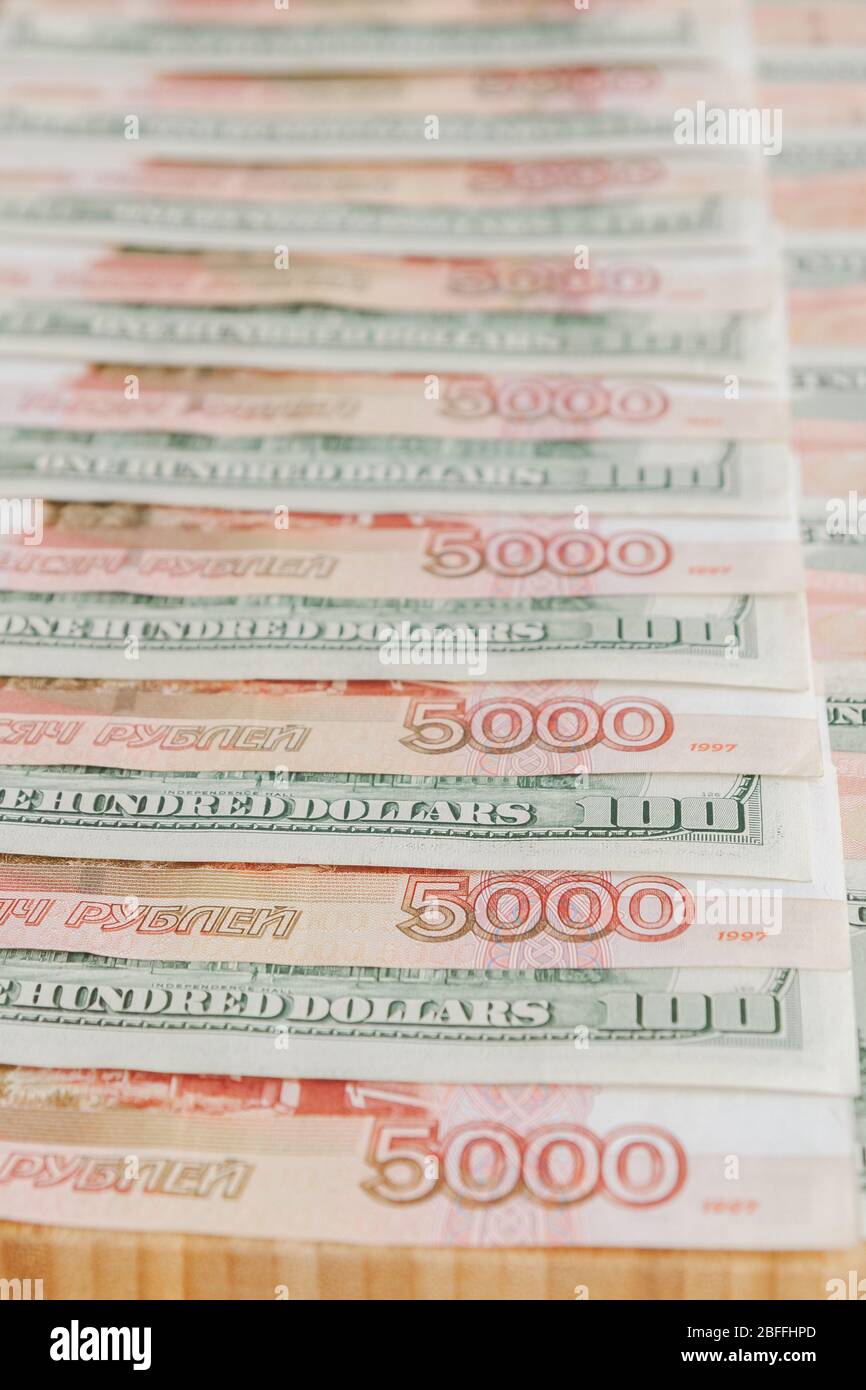 A large number of American hundred dollar bills and Russian five ...