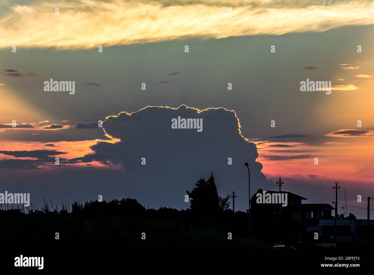 Strange cloud on the sunset Stock Photo - Alamy