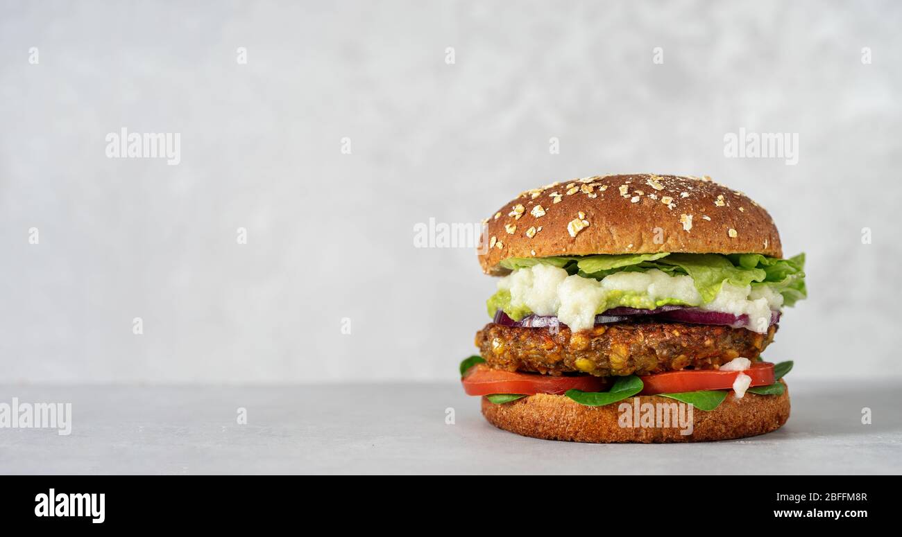Vegan lentils burger with vegetables on light gray background Stock ...