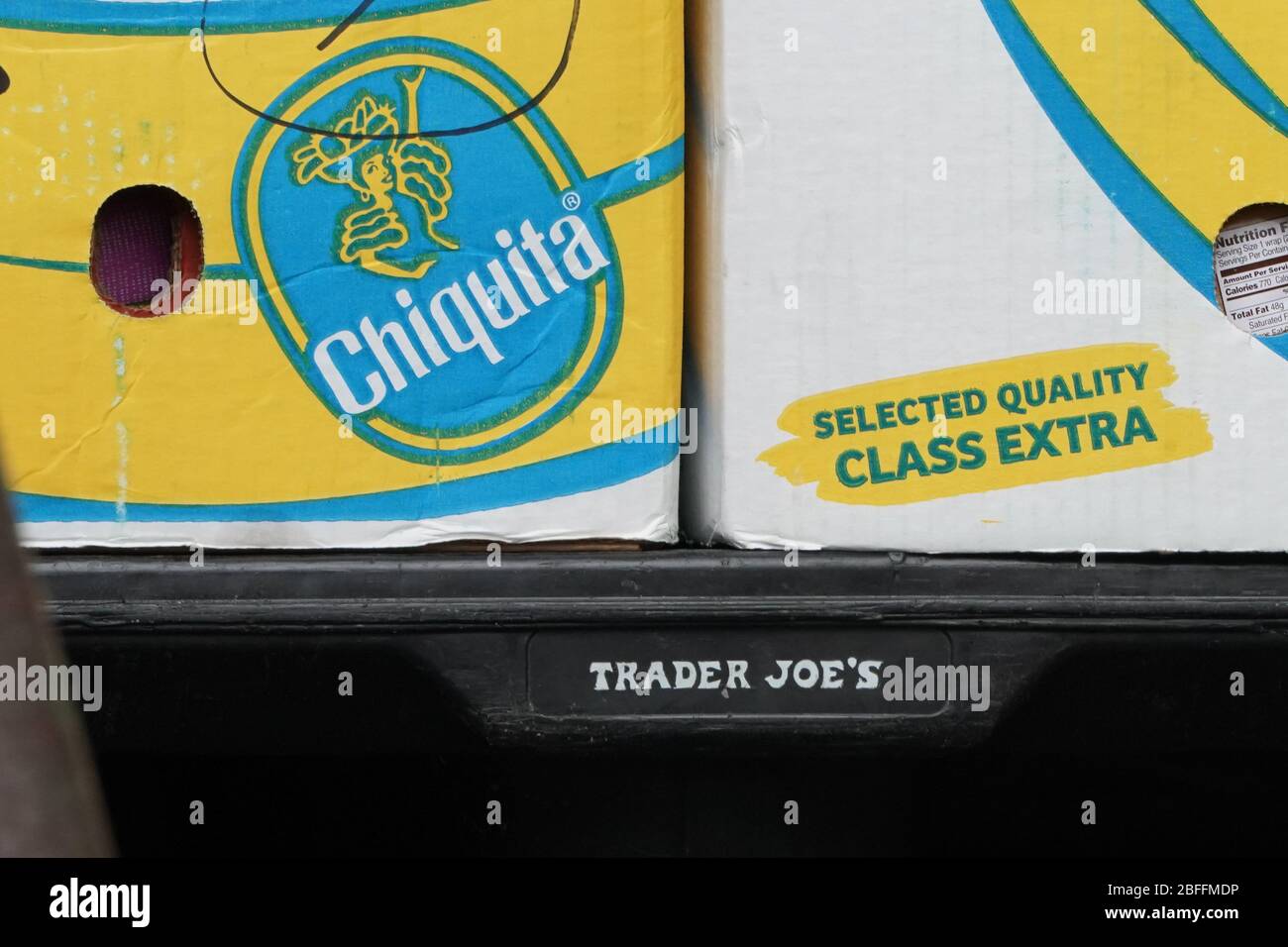 New York, NY, USA. 18th Apr, 2020. People pick up boxes with food ...