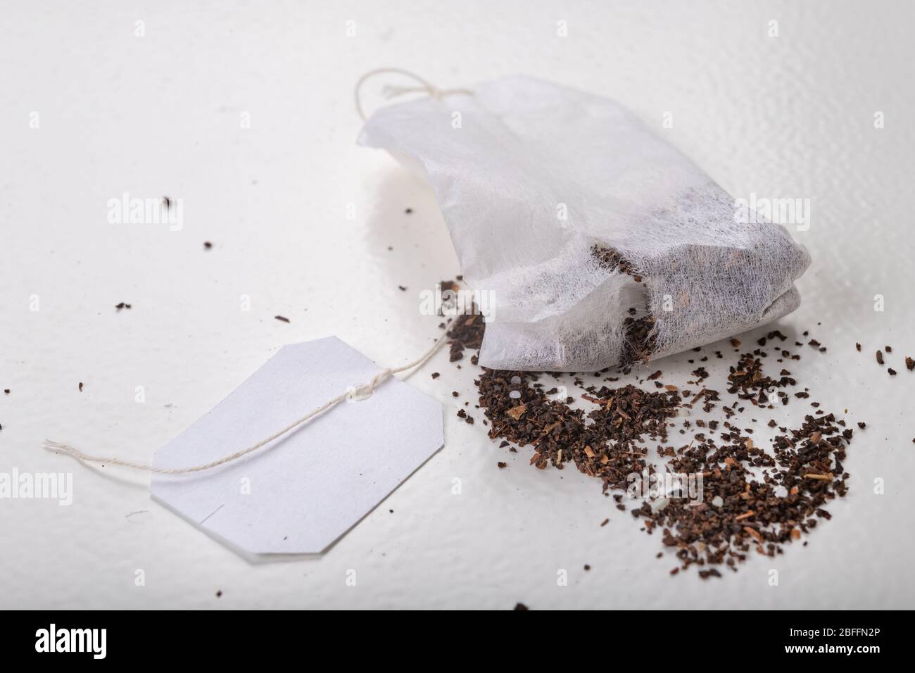 Torn tea bag. Damaged tea that cannot be used. Light background Stock ...