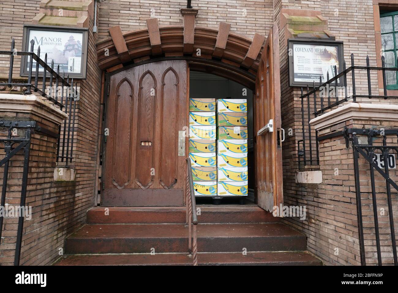 New York, NY, USA. 18th Apr, 2020. People pick up boxes with food ...