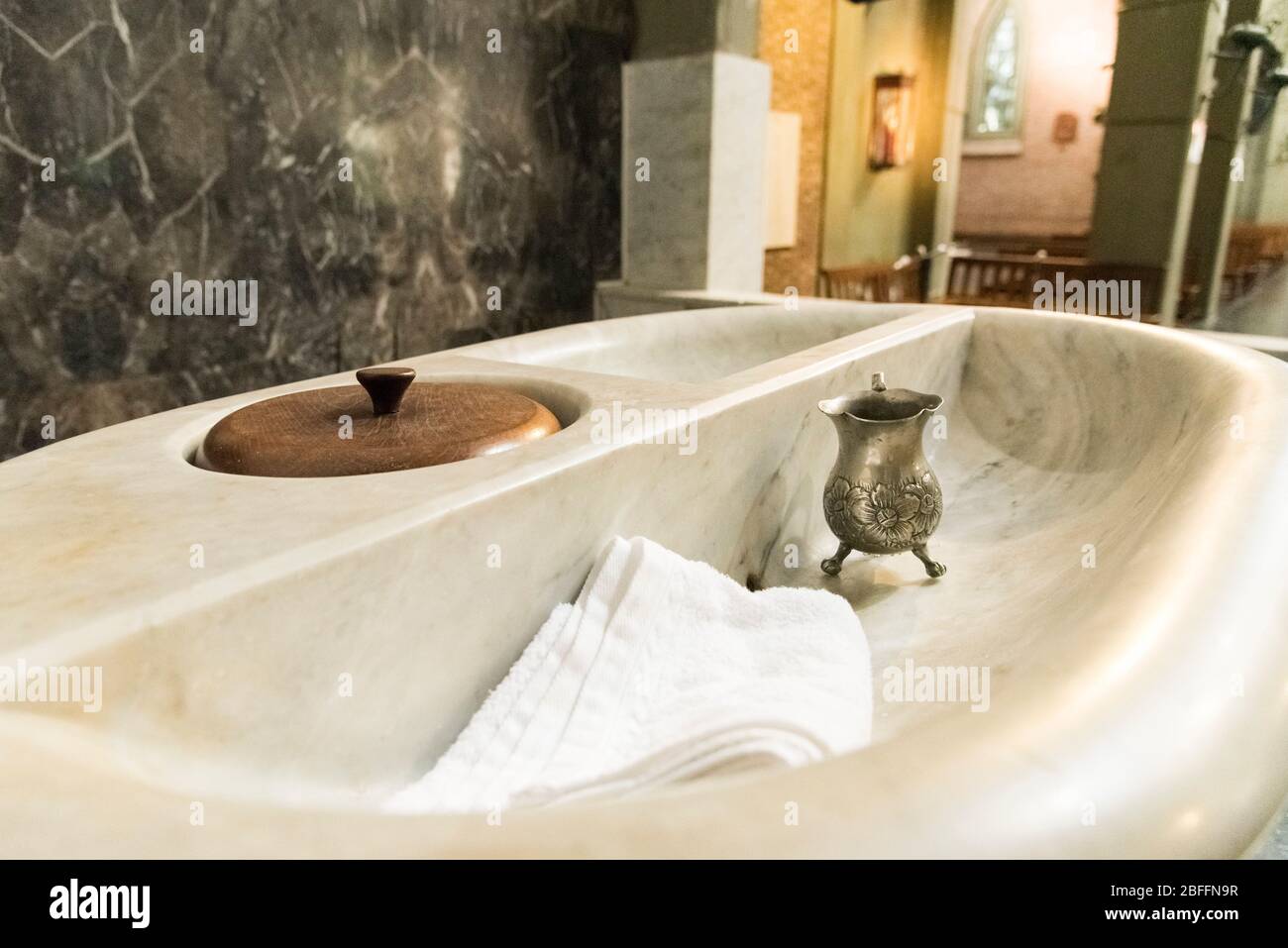 Baptismal font prepared for a baptism ceremony Stock Photo - Alamy