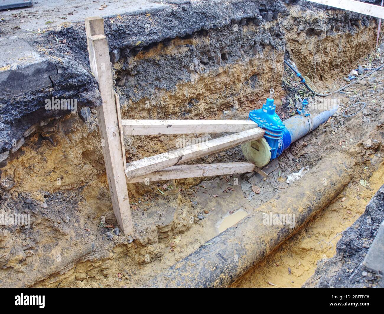 Building site in front of flat house. Repairing of water supply ...