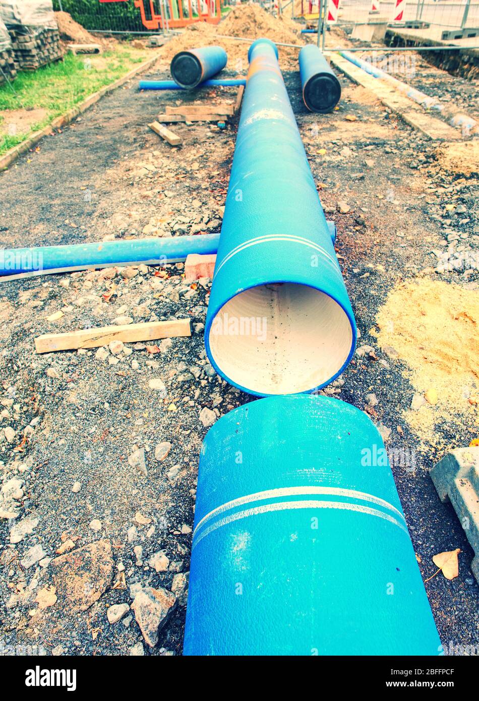 Pipes on building site ready for using underground. New pipeline for ...