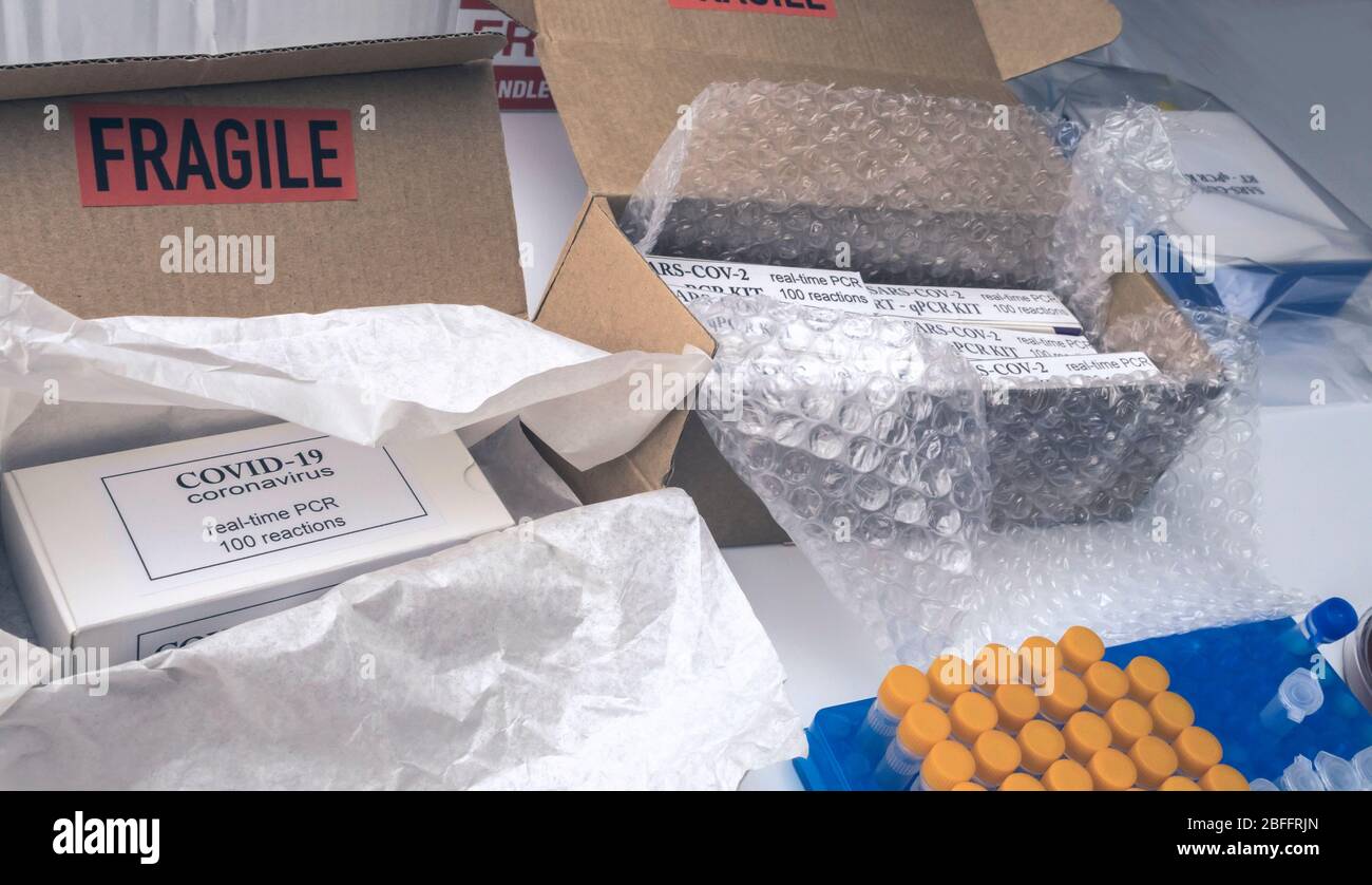 Boxes with Covid-19 PCR kit in hospital warehouse, conceptual image ...