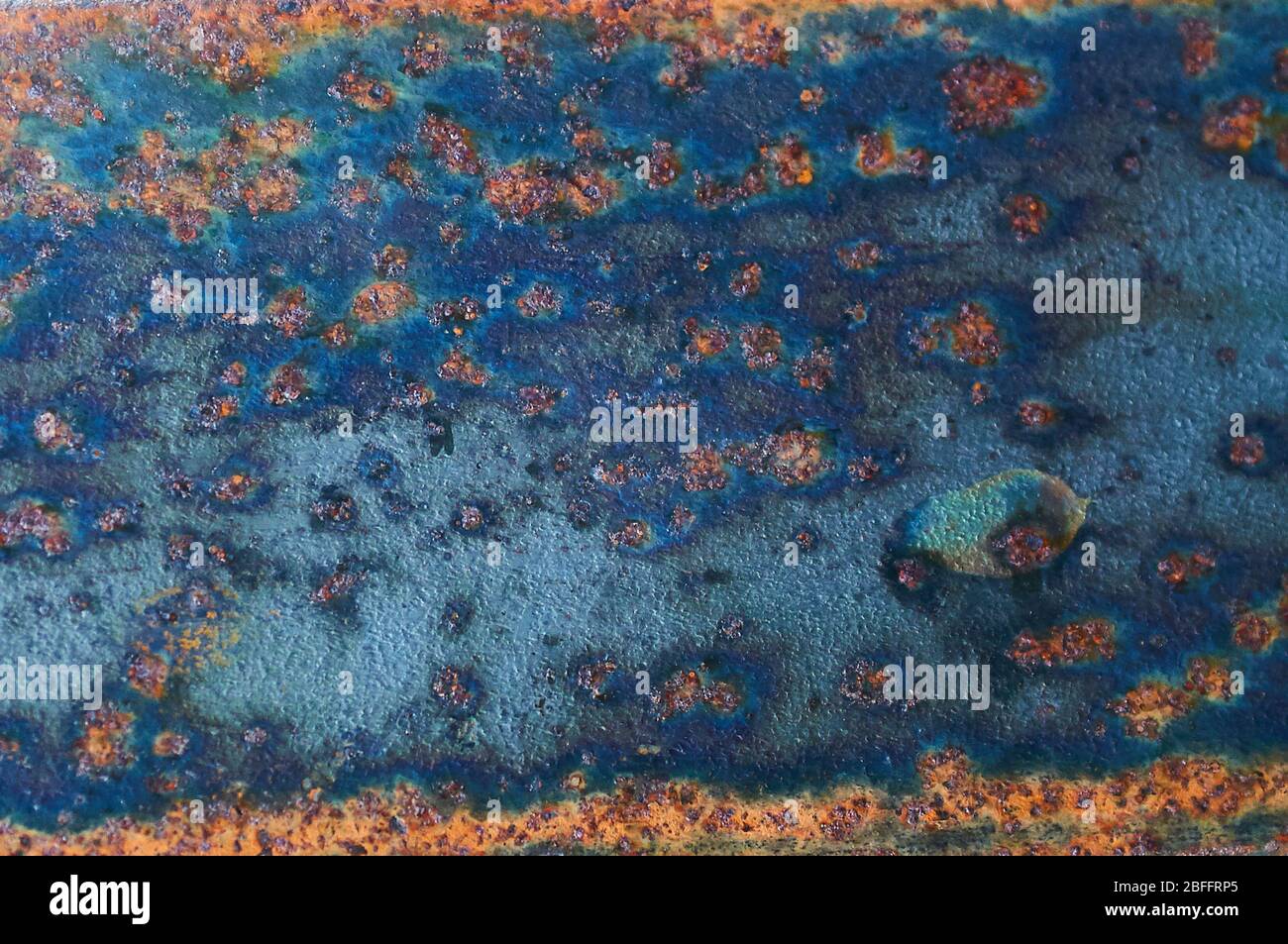 Detail of the oxidation produced in a metal object. Vivid colors ...