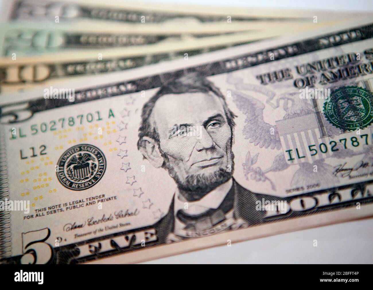 Illustrative image of various denomination US dollar bills Stock Photo ...