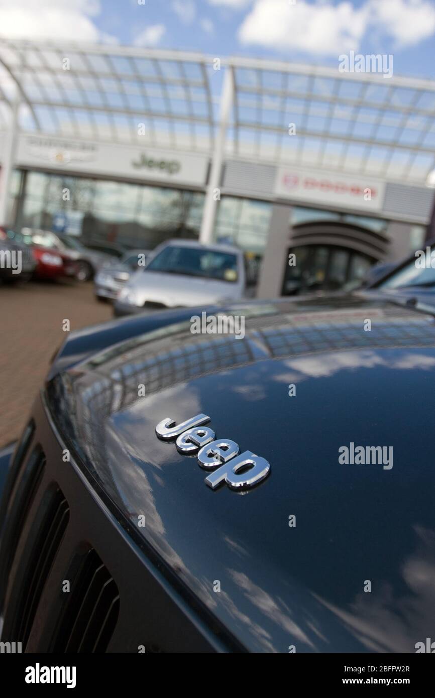 A Jeep motor car outside a dealership showroom in Cambridge Stock Photo ...