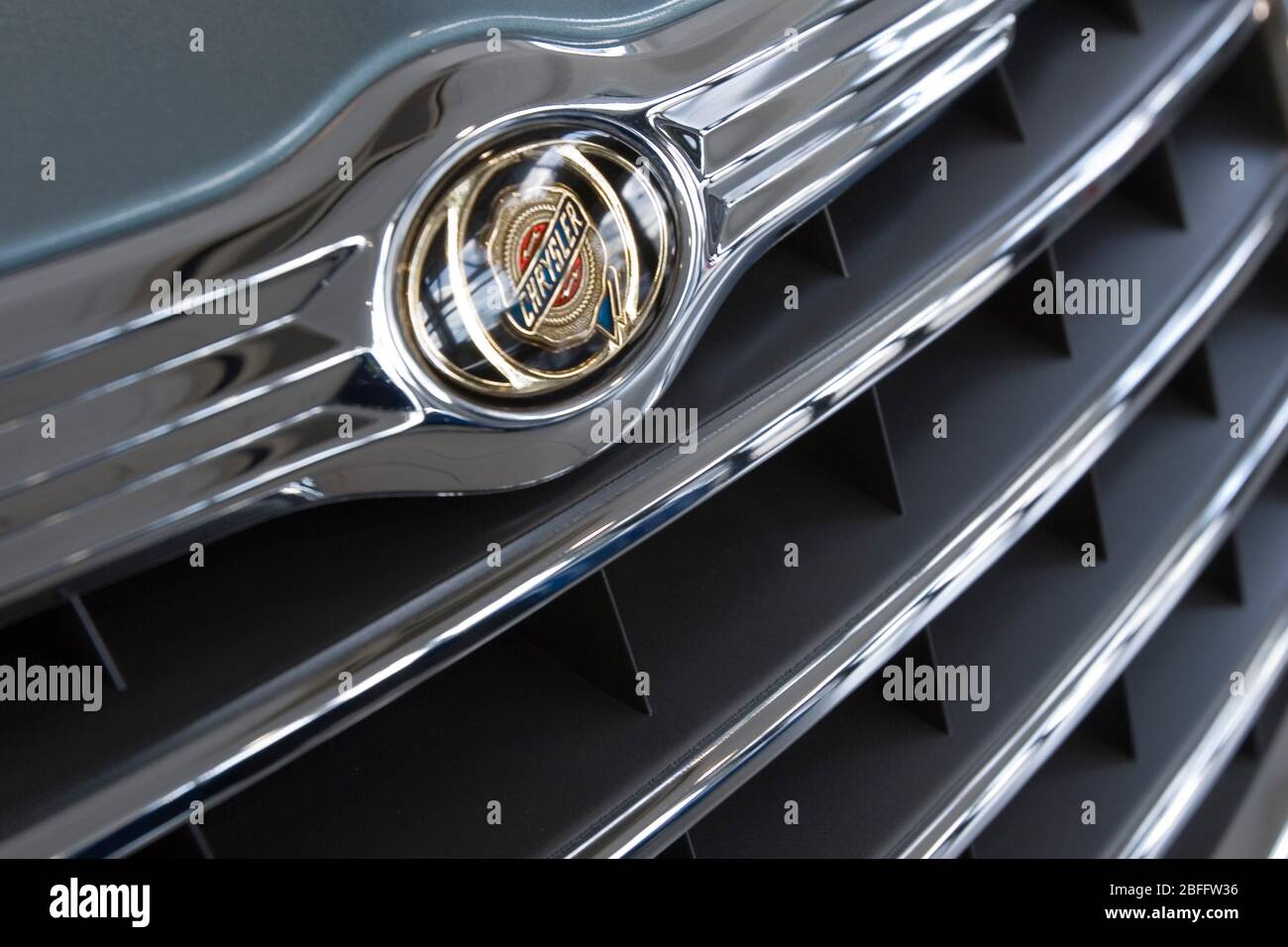 Chrysler badge mounted on the front of a car Stock Photo - Alamy