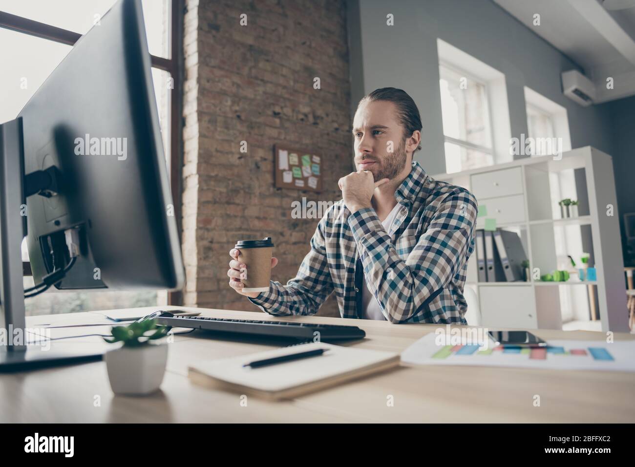 Photo of handsome business guy look computer monitor table reading ...