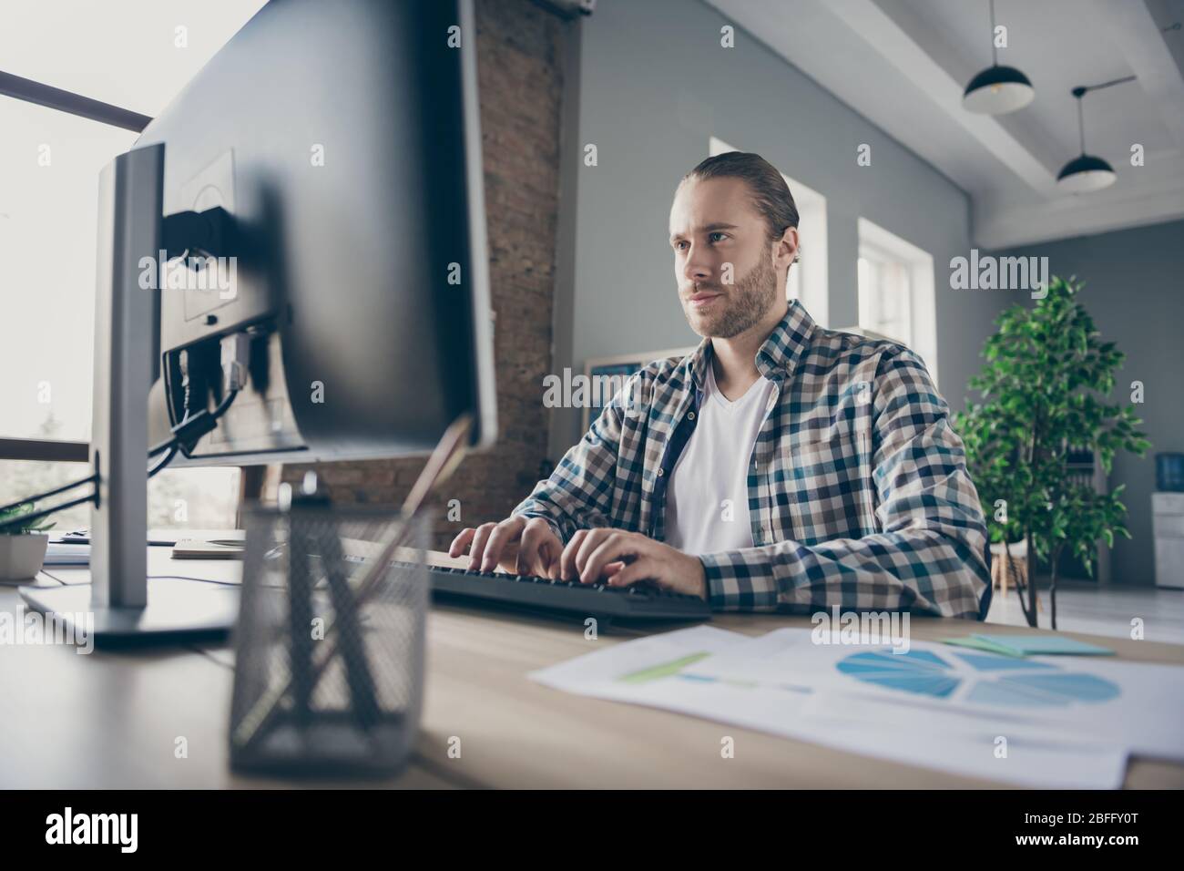 Photo of handsome business guy look computer monitor table chatting ...