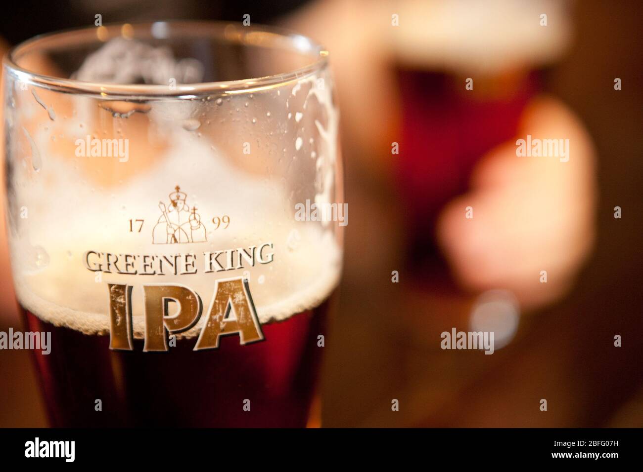 A pint of Greene King IPA in a branded glass Stock Photo - Alamy