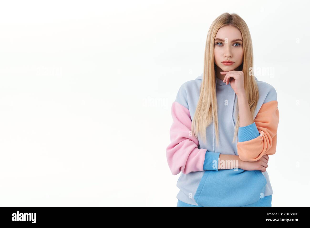 Portrait of serious-looking, determined smart attractive girl with long ...