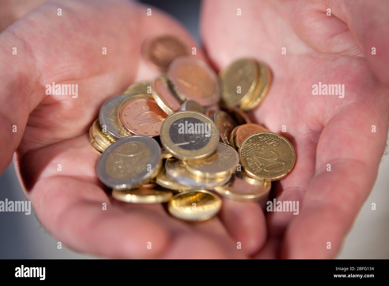 A handful of various denomination Euro coins Stock Photo - Alamy