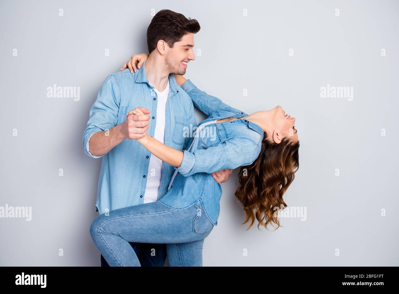 Portrait of positive affectionate tender gentle spouses hug hold hand ...