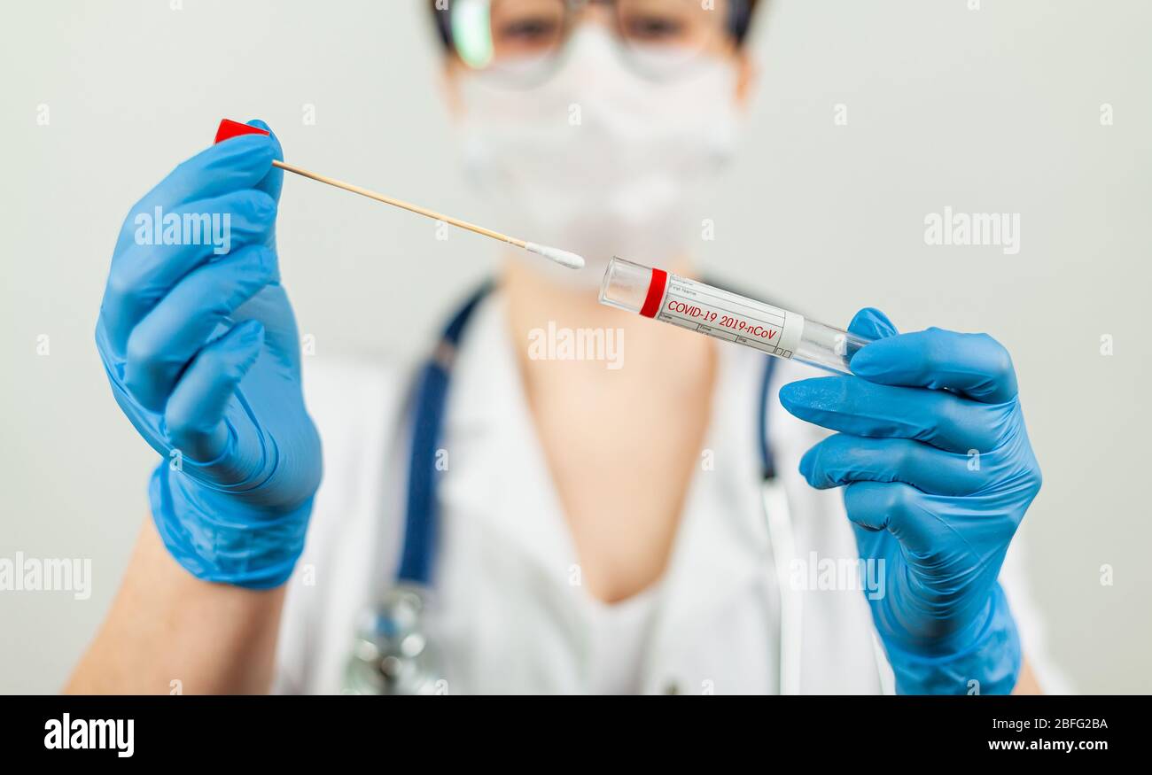 Test for coronavirus Covid-19. Female doctor or nurse doing lab ...