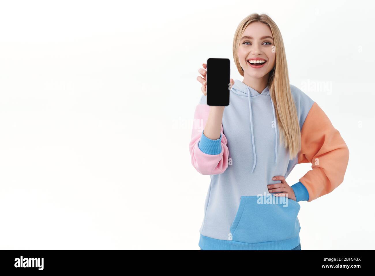 Communication, smartphone and promo concept. Happy attractive blonde ...