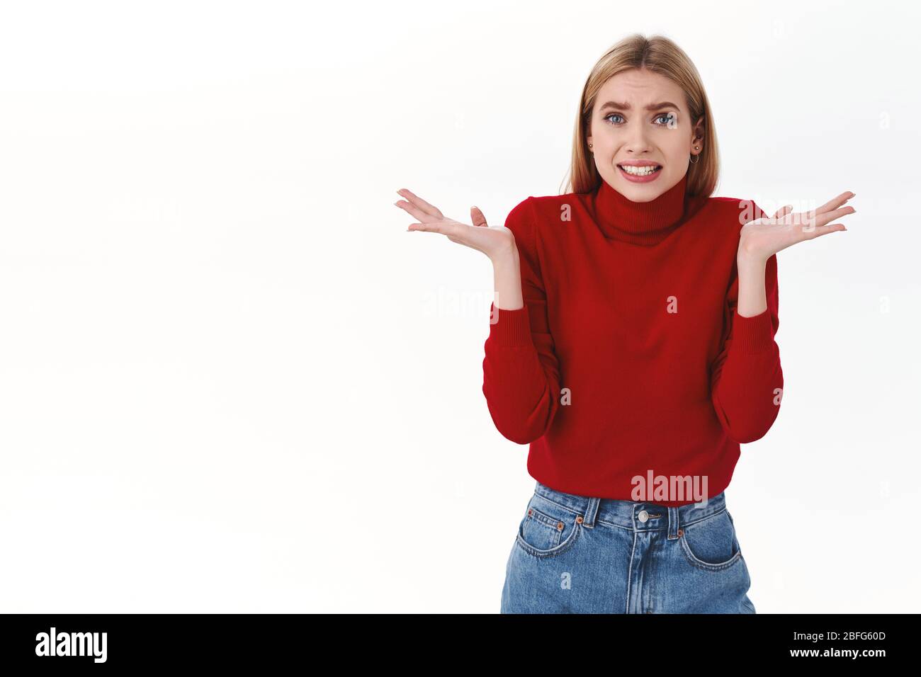 Work, career and lifestyle concept. Worried, embarrassed blond woman ...