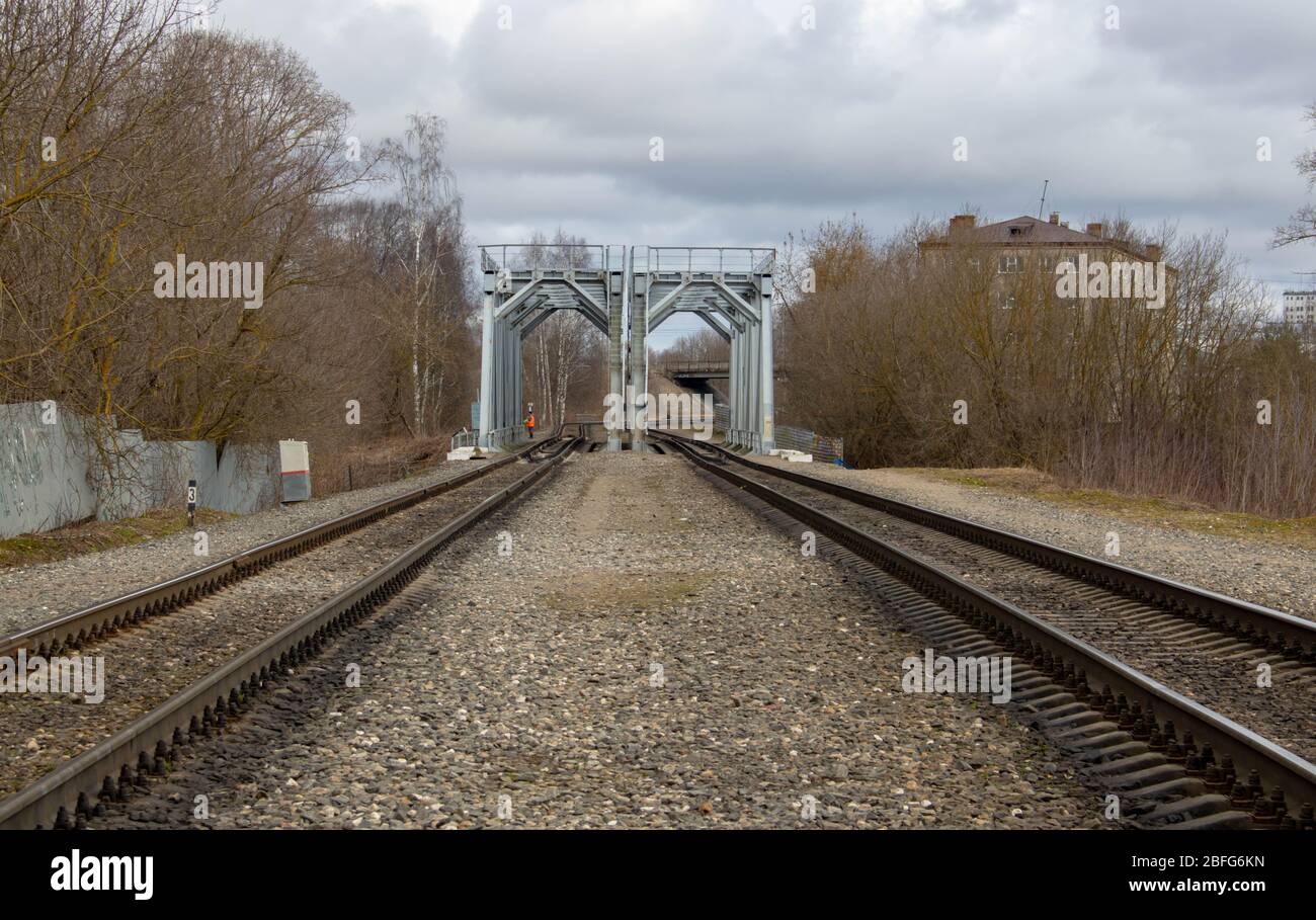 The railway tracks lead to the bridge.Old rails in landscape Stock ...
