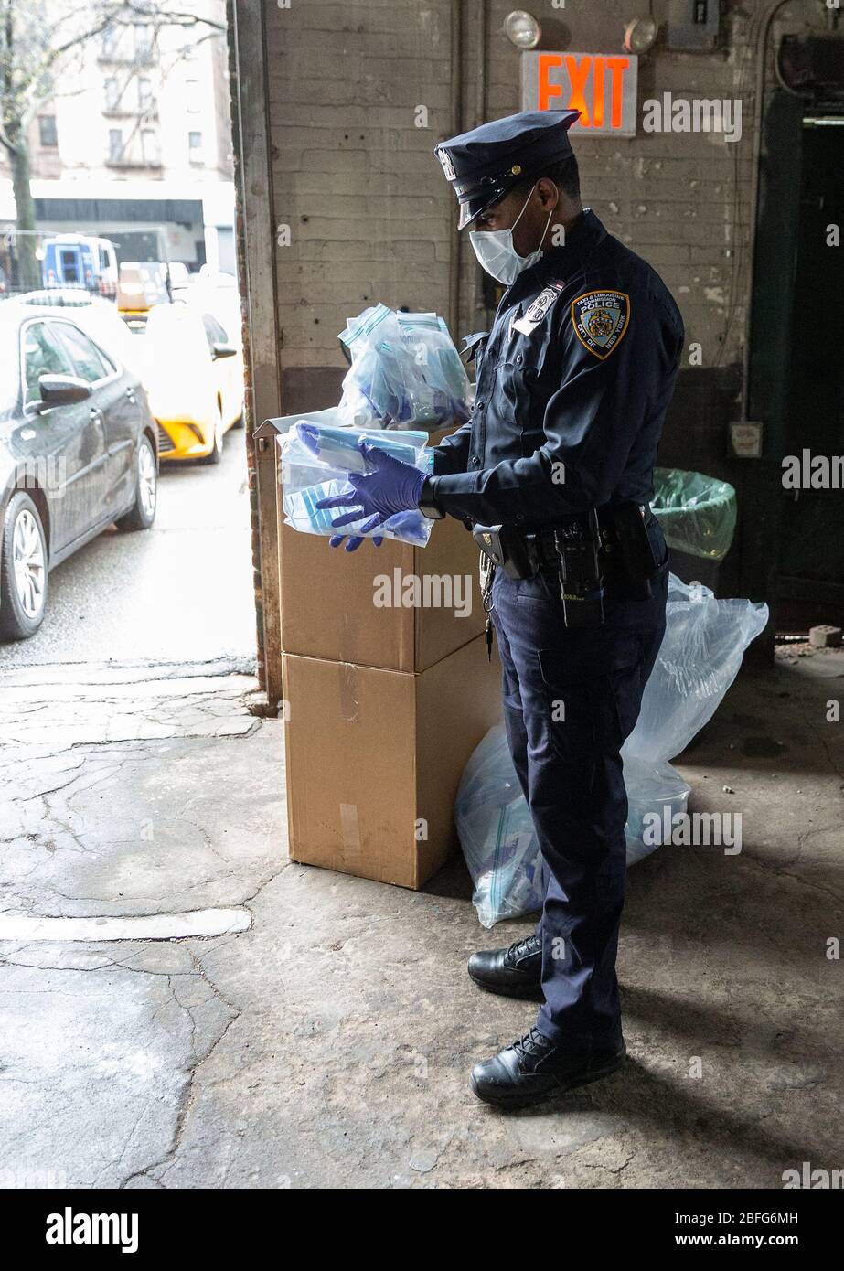 New York, United States. 18th Apr, 2020. TLC officer prepares bag with ...