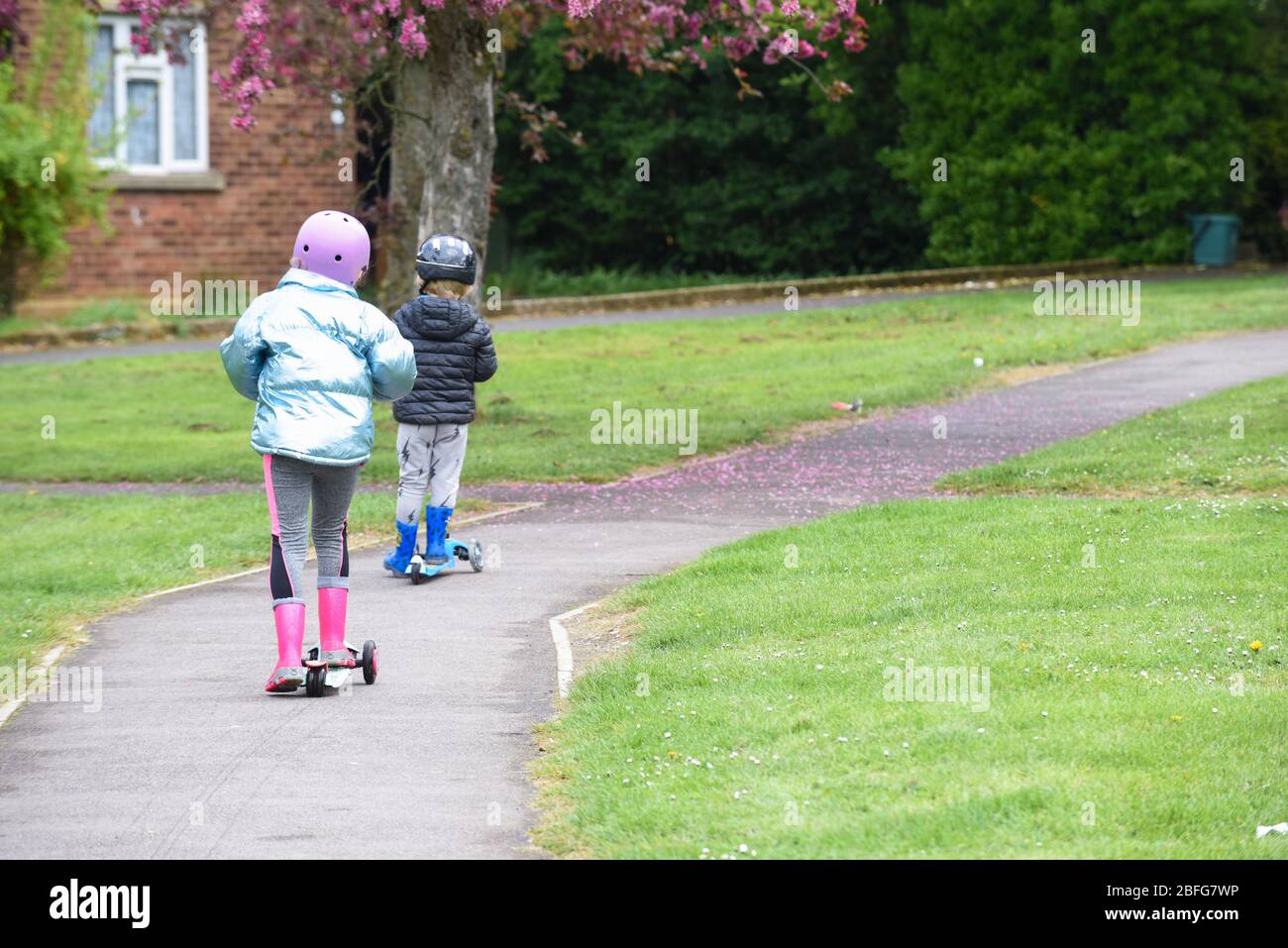 Children play outside once per day during a lockdown due to coronavirus ...