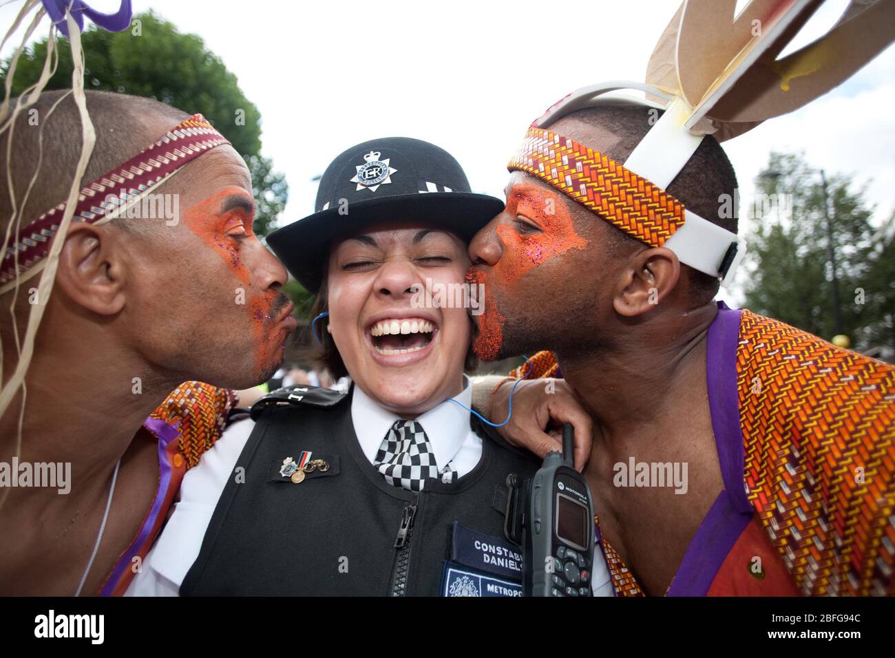 Two dancer kissing a woman police officer during the second day of ...