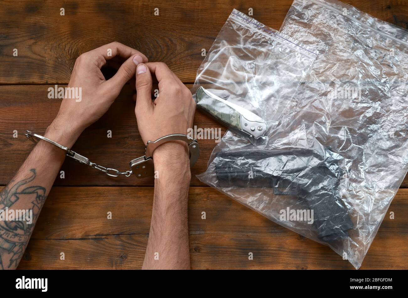 Crime scene suspect handcuffed hi-res stock photography and images - Alamy