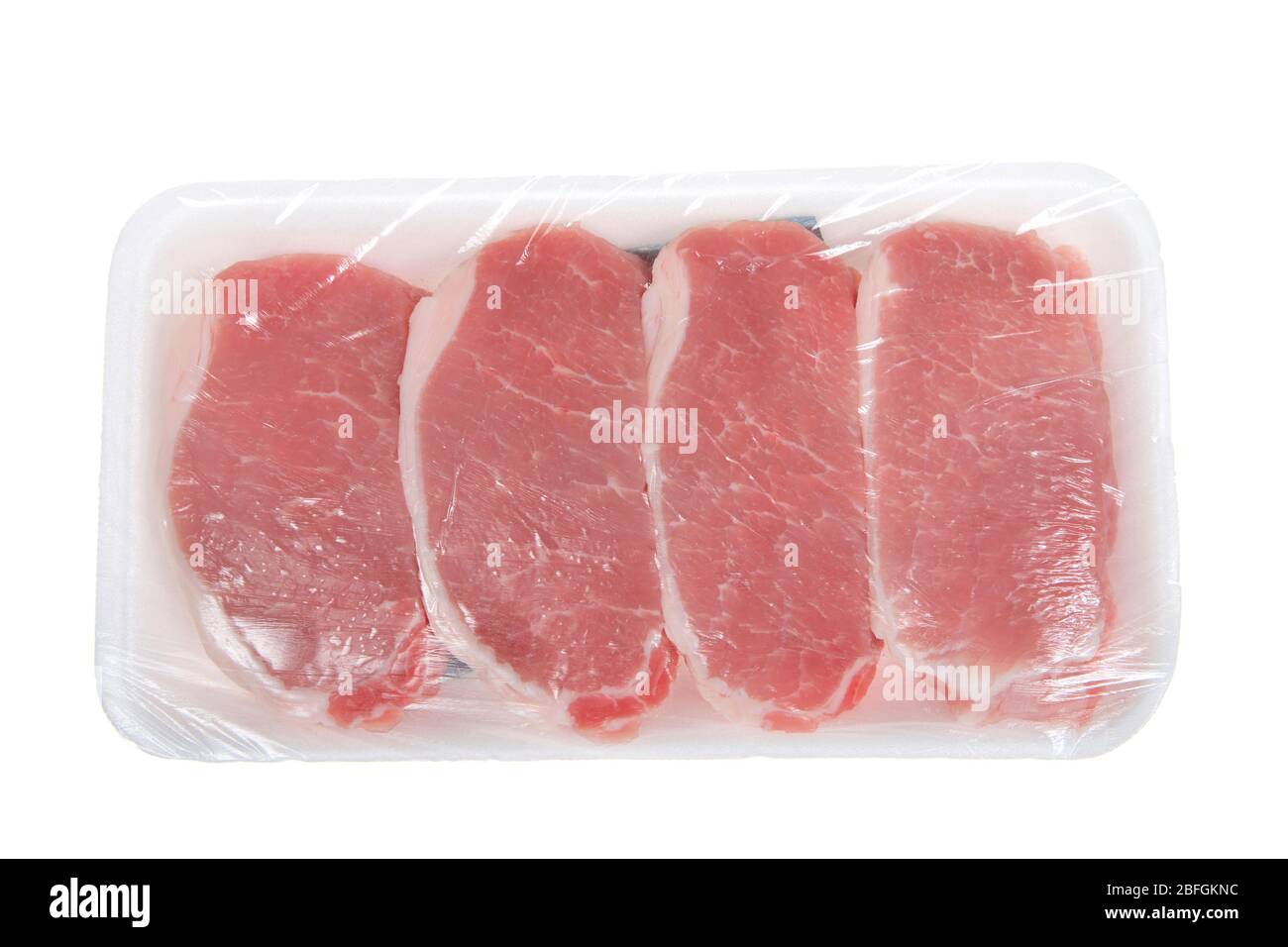 White Foam tray with fresh boneless pork chops wrapped in plastic ...