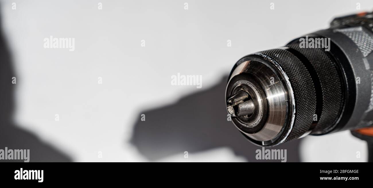 metal keyless chuck on drill and impact driver extended in the open ...