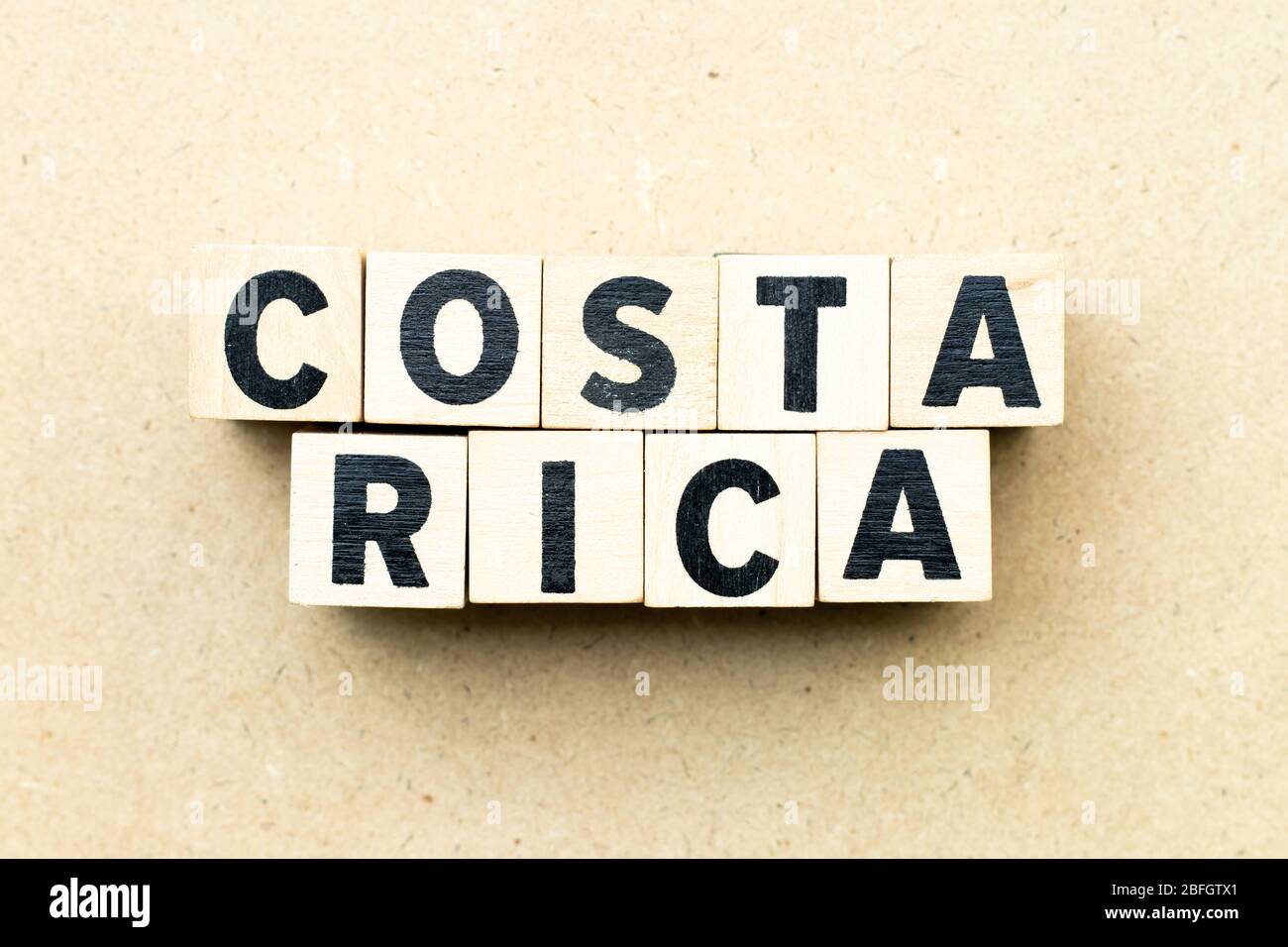 Letter block in word costa rica on wood background Stock Photo - Alamy