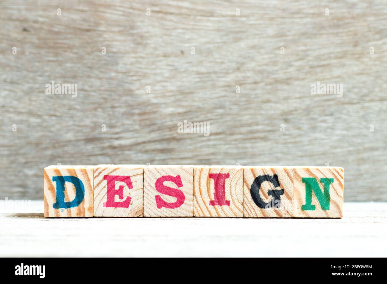 Alphabet letter block in word design on wood background Stock Photo - Alamy