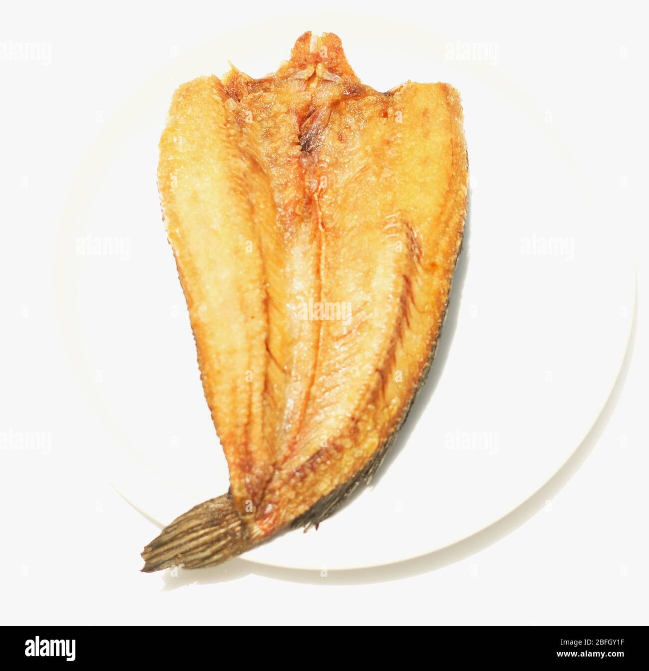Fried fish on white Cut Out Stock Images & Pictures - Alamy