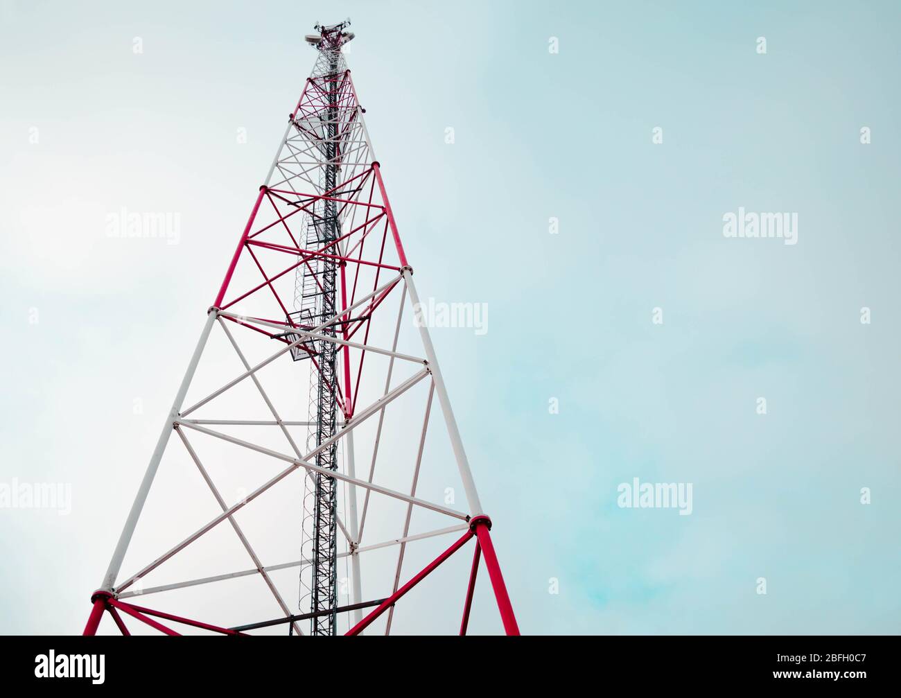 Cell tower against blue sky. Radio antenna tower structure Stock Photo ...