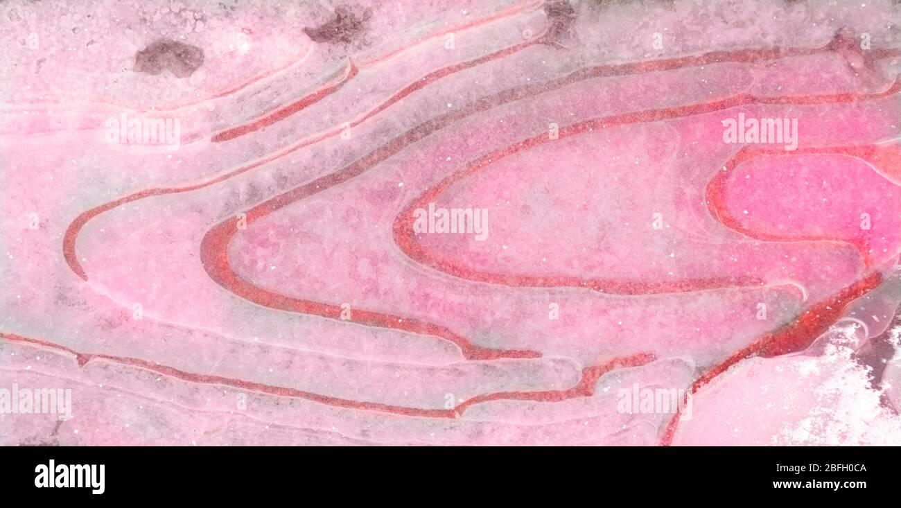 Frozen waterIce background for an inscription. Pink ice Stock Photo - Alamy