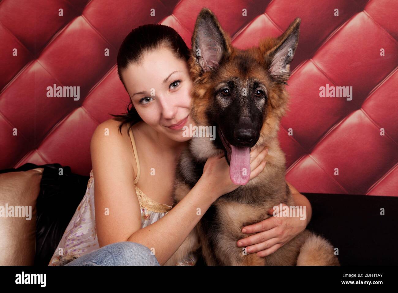 Cute Portrait of Happy Young Woman hugging and cuddling with the Lovely ...