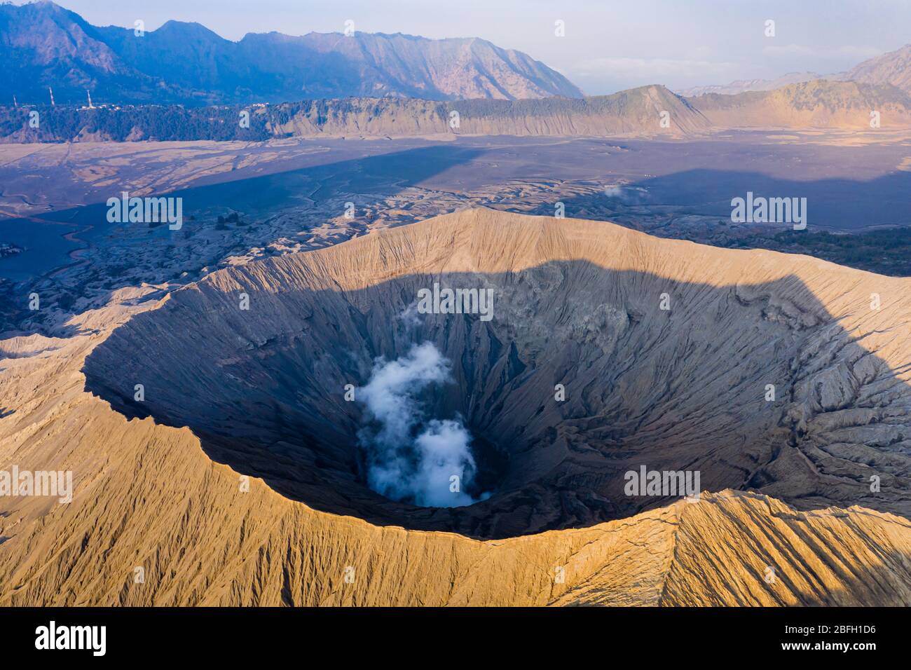 Aerial drone view of steam and volcanic gas venting from the crater of ...