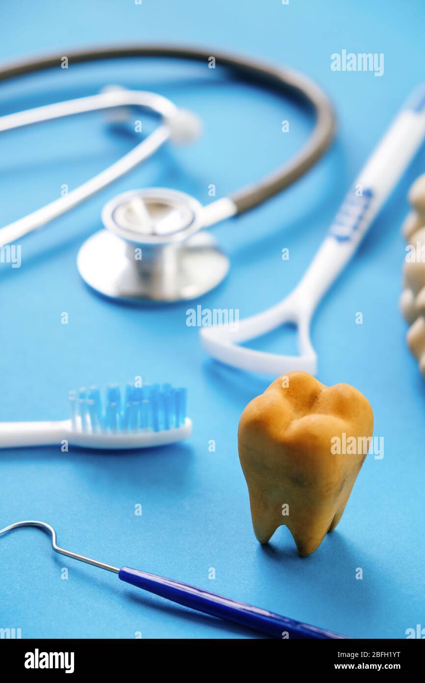 Dental model and dental equipment on blue background, concept image of ...
