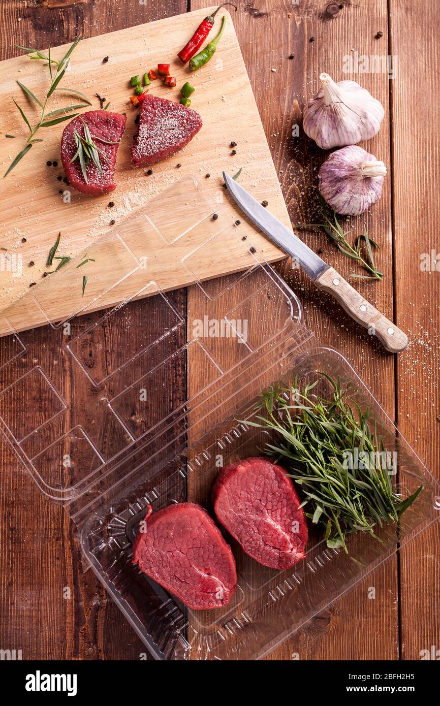 Steak meat ready to cook in a plastic container Stock Photo - Alamy
