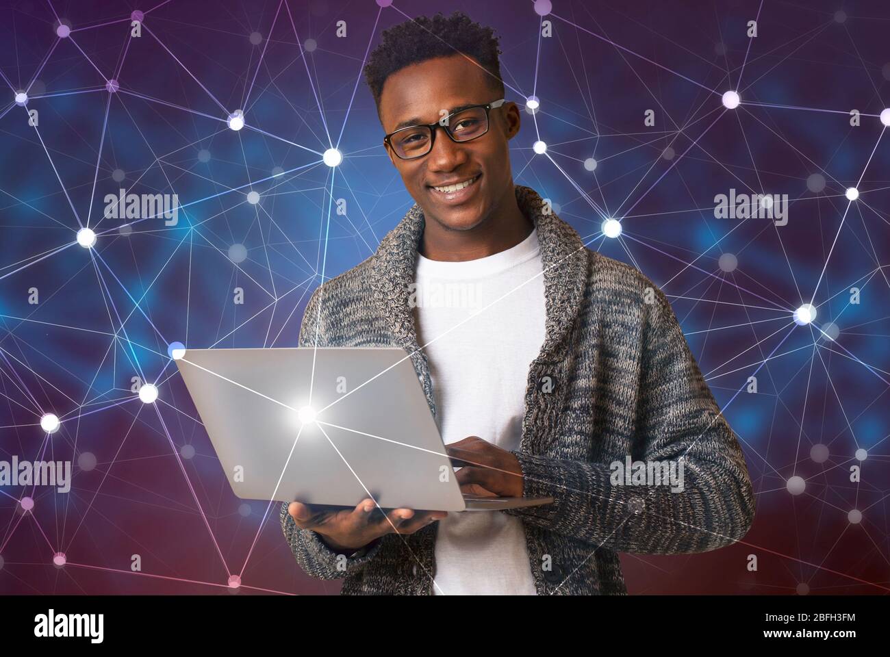 Man using personal computer with flying network Stock Photo - Alamy