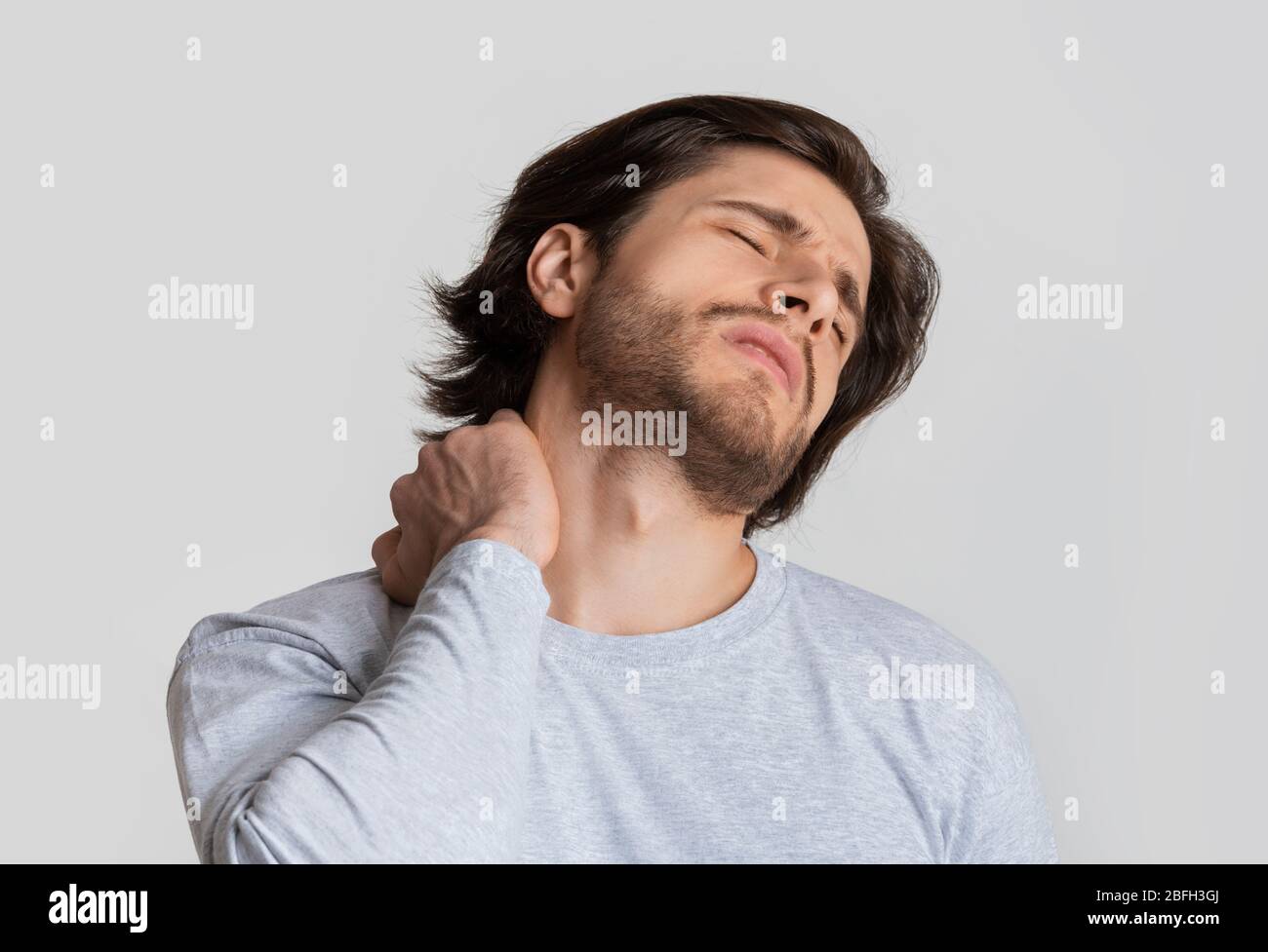 Hand in the neck hi-res stock photography and images - Alamy