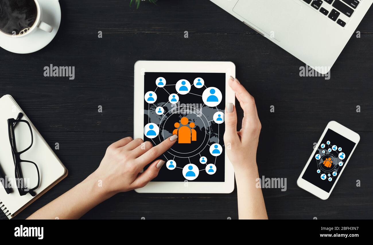 Online Communication Concept. Female worker using tablet Stock Photo ...