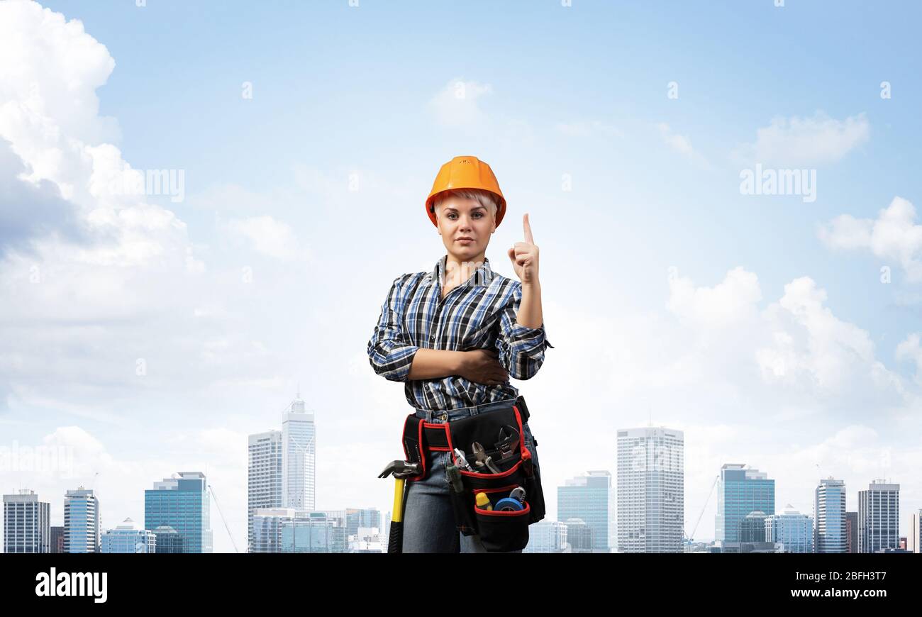 Beautiful female builder in hardhat Stock Photo - Alamy