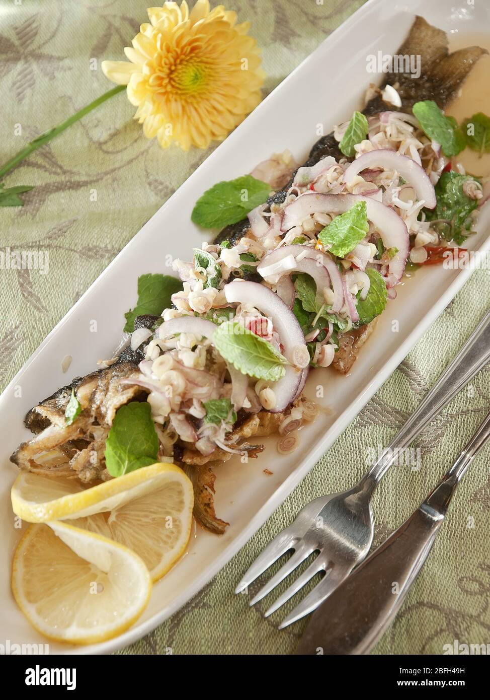 fried fish with fish sauce delicious thai food Stock Photo - Alamy