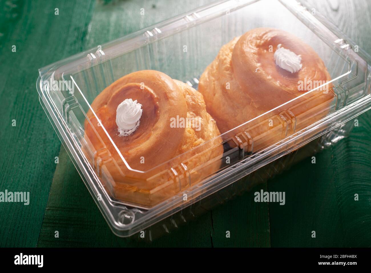 Delicious cream puff in plastic container Stock Photo - Alamy