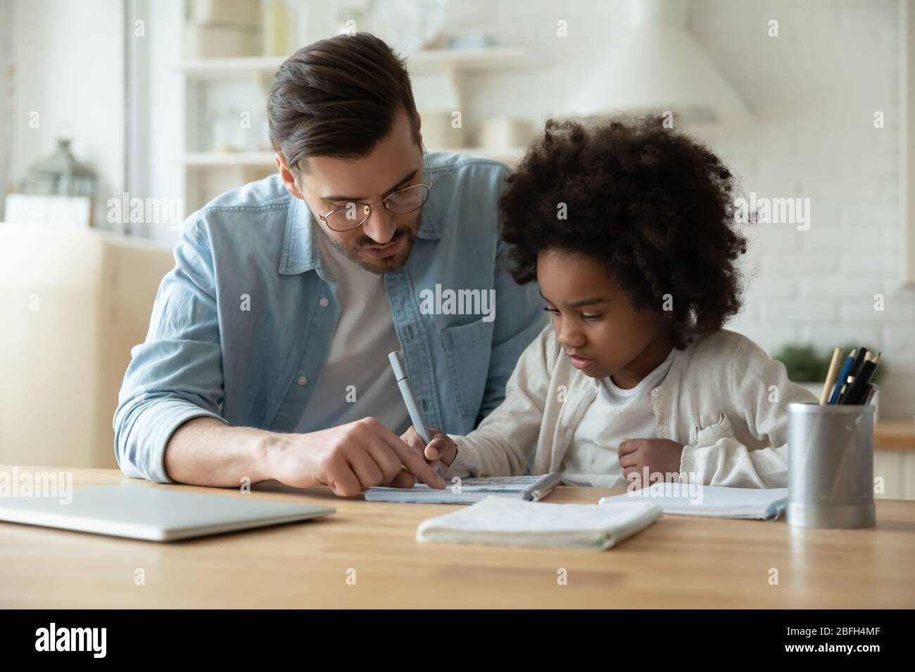 African father child homework hi-res stock photography and images - Alamy