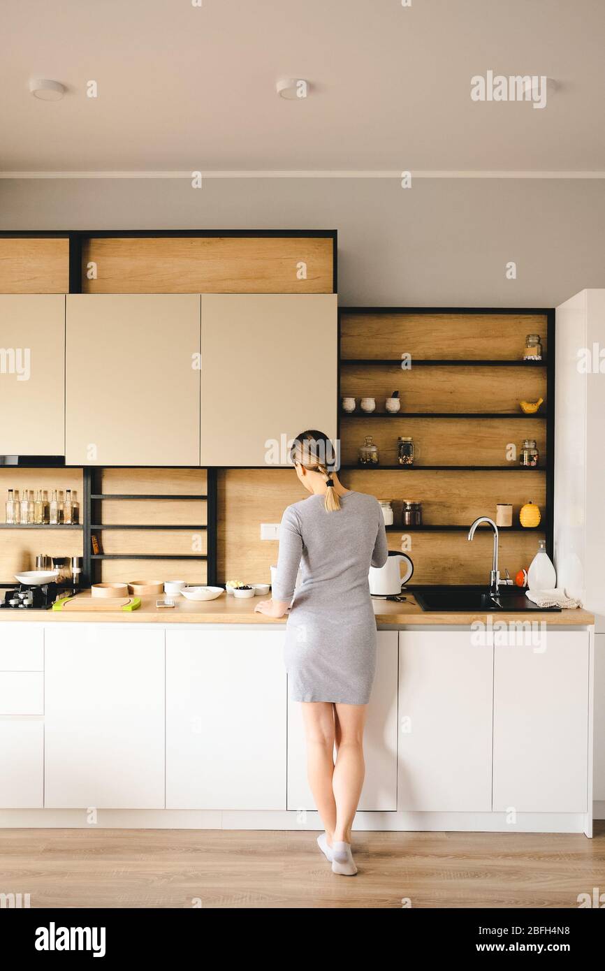 Back view woman cooking in kitchen hi-res stock photography and images ...