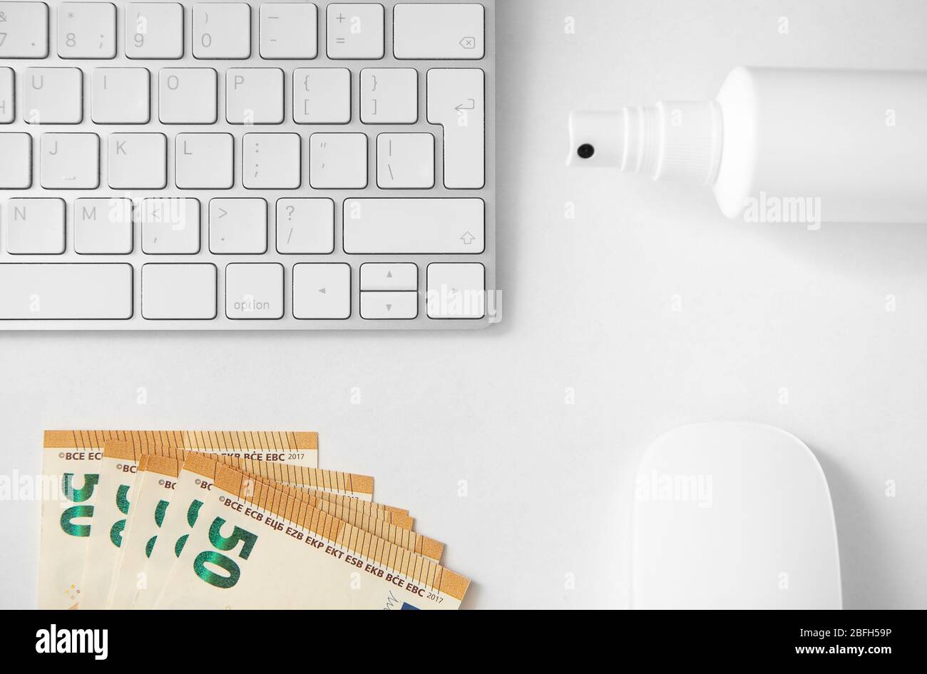 Computer keyboard, computer mouse,disinfectant spray and money Stock ...