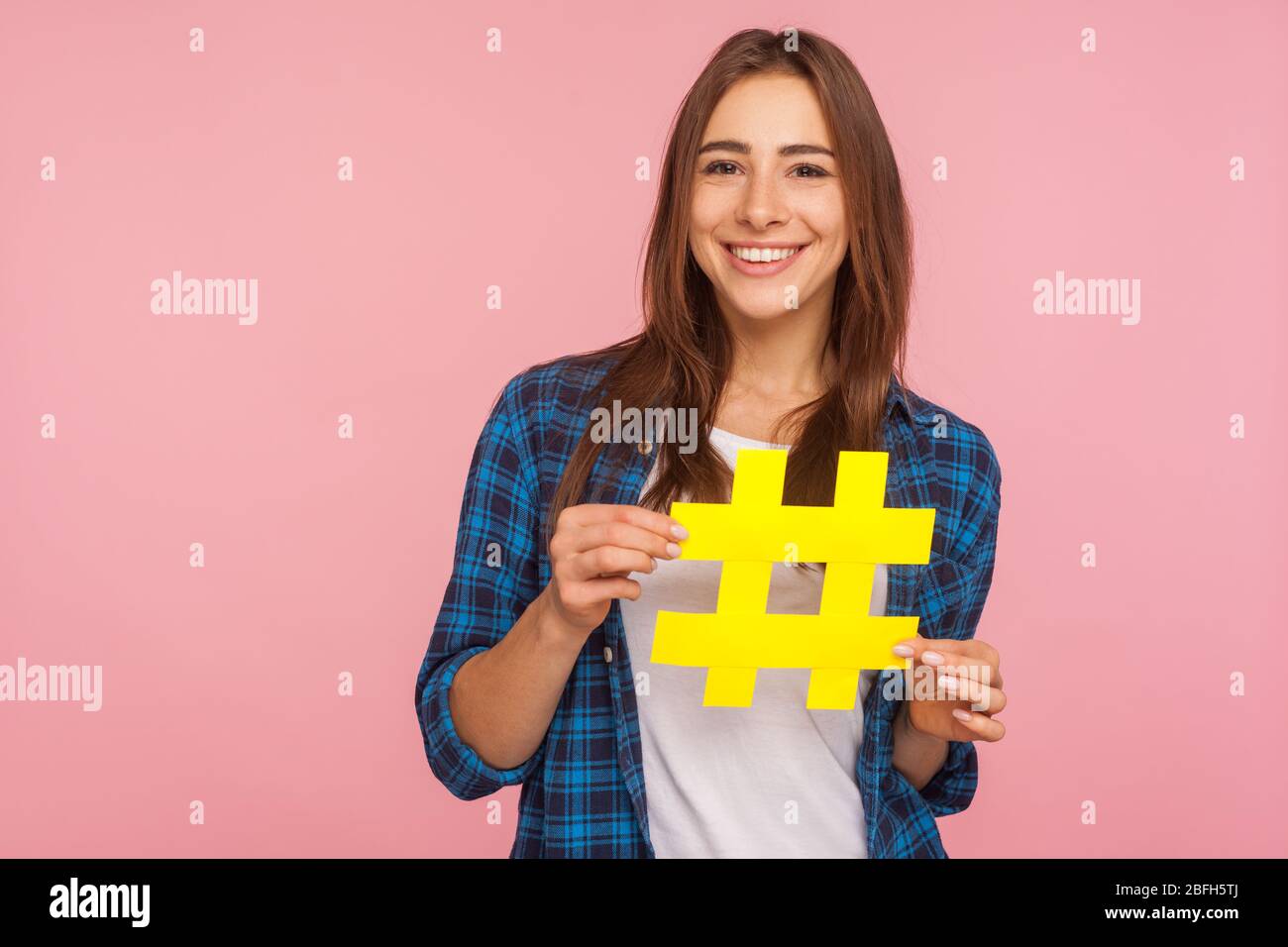 Viral blog post. Happy pretty smiling girl in checkered shirt holding ...