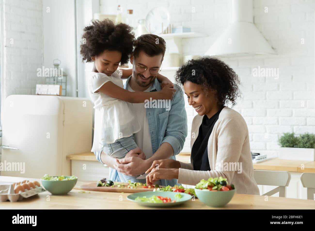 Kid help parents cooking hi-res stock photography and images - Alamy